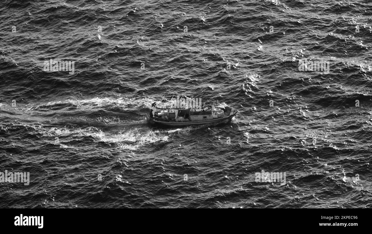 Cargo ship at sea. transit ship. Sailboats. Fishing boat. Fishing ...