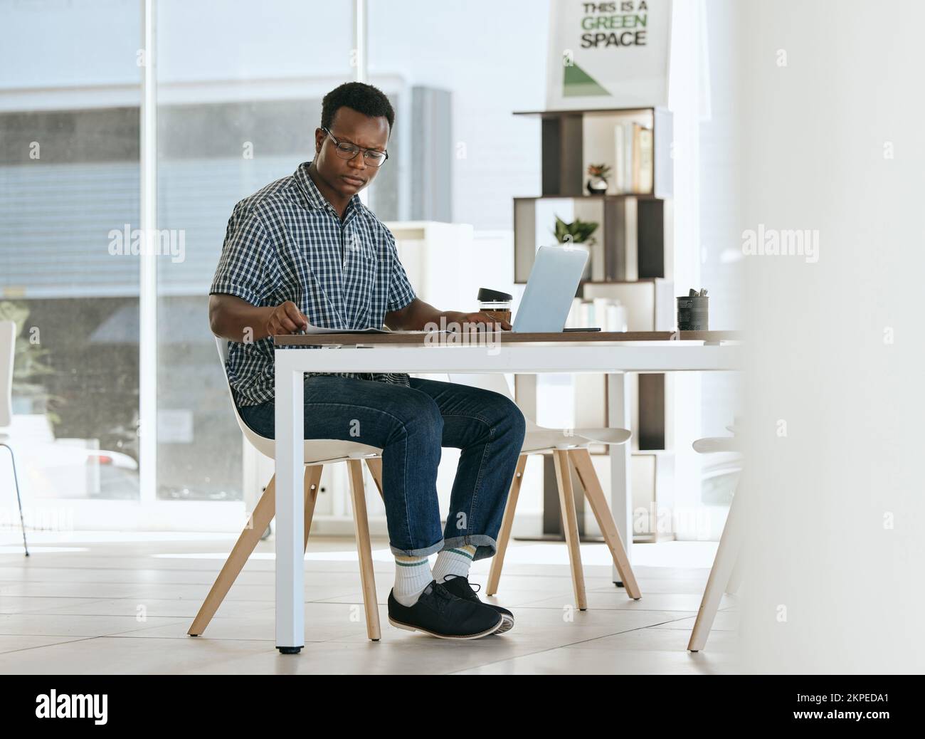 Black man, startup business and employee with laptop working in an open ...