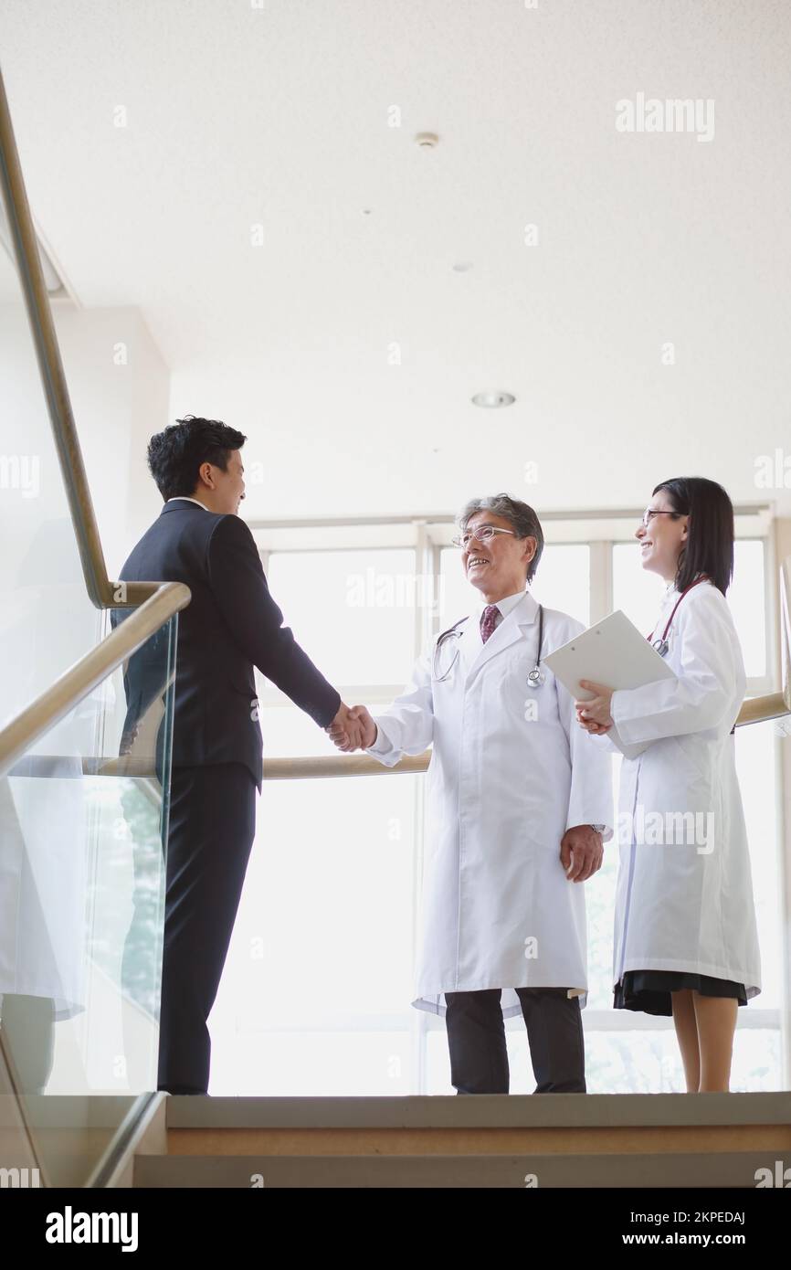 Salesman and Doctors Stock Photo - Alamy