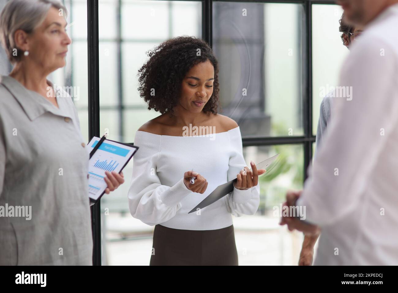 Conversation between managers and employees in the office Stock Photo ...