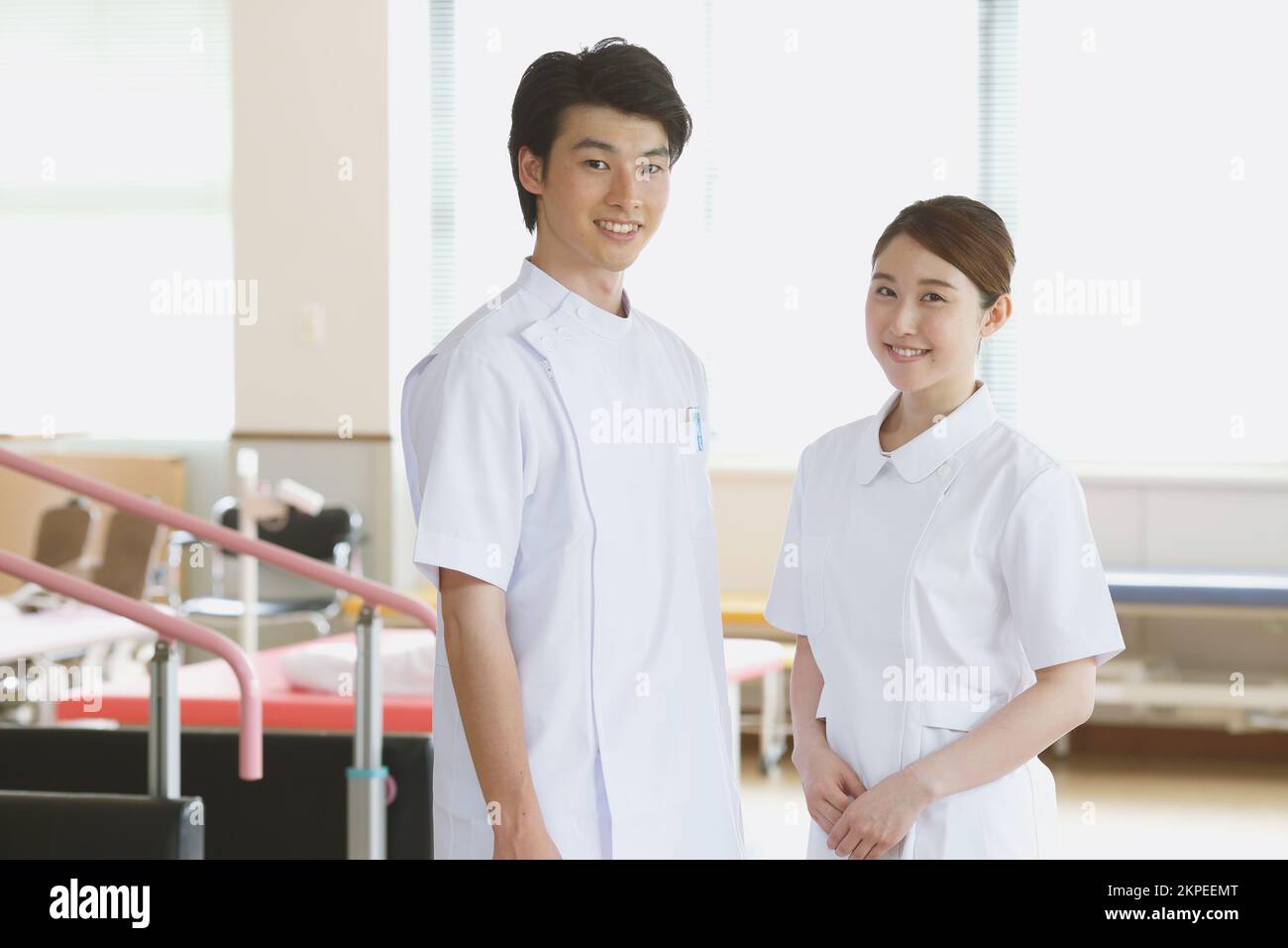Smiling young Japanese nurses in rehab facility Stock Photo - Alamy