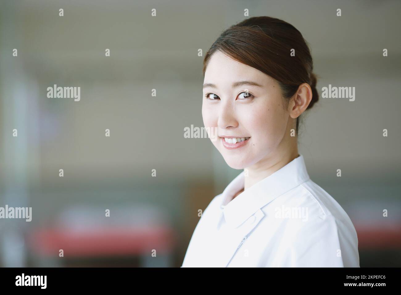 Smiling young Japanese female nurse Stock Photo - Alamy
