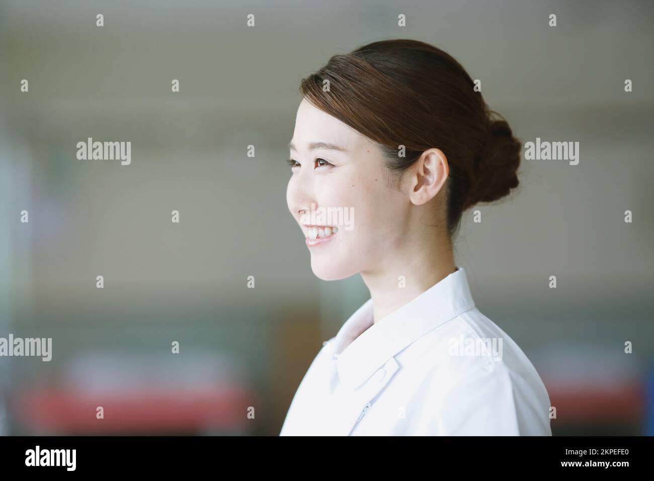 Smiling young Japanese female nurse Stock Photo - Alamy