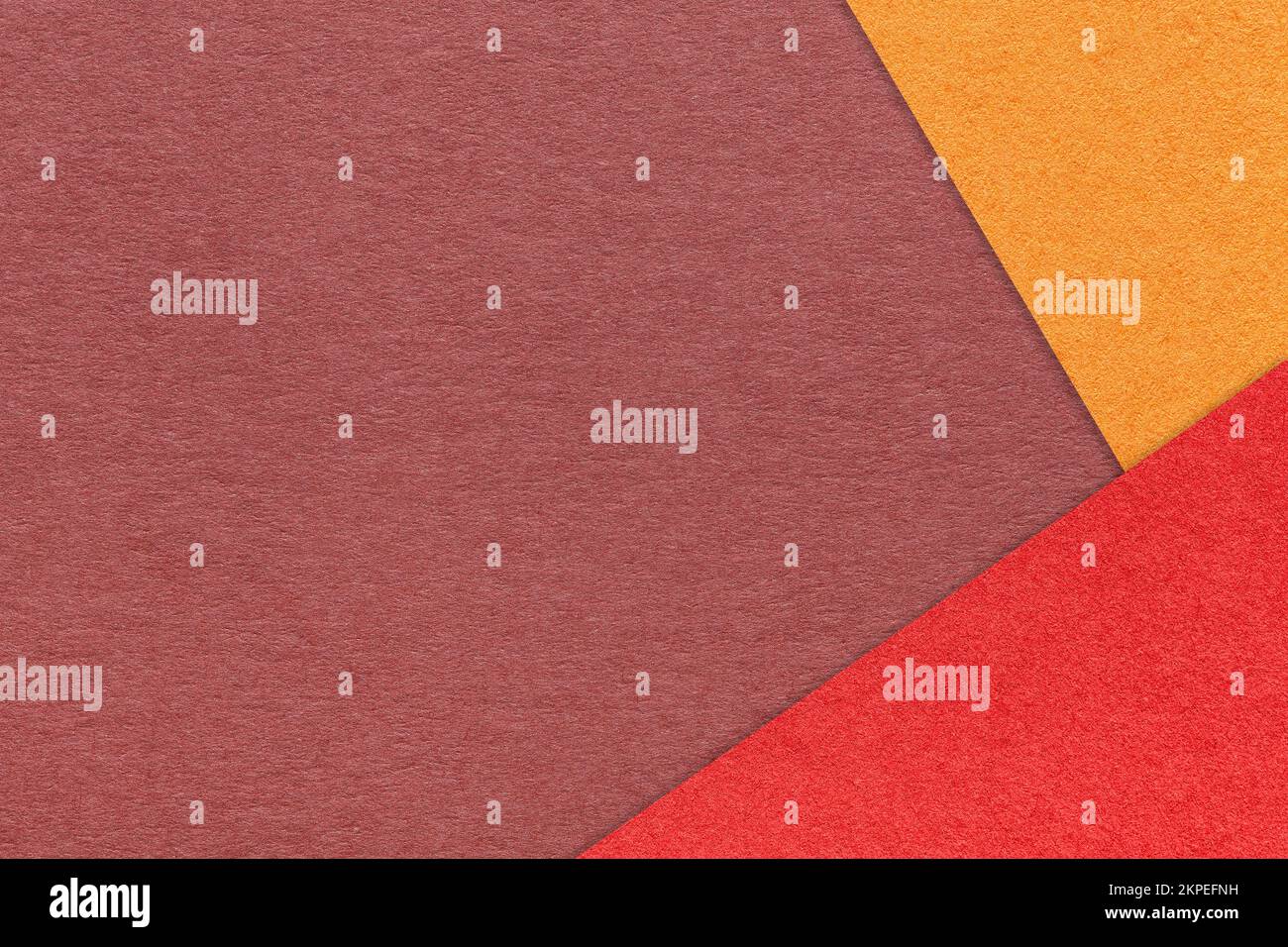 Texture of craft wine color paper background with red and orange border ...