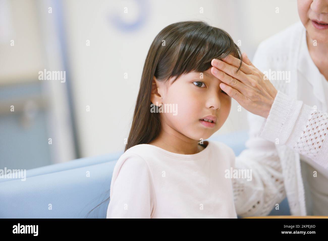 Japanese girl taking a temperature Stock Photo - Alamy