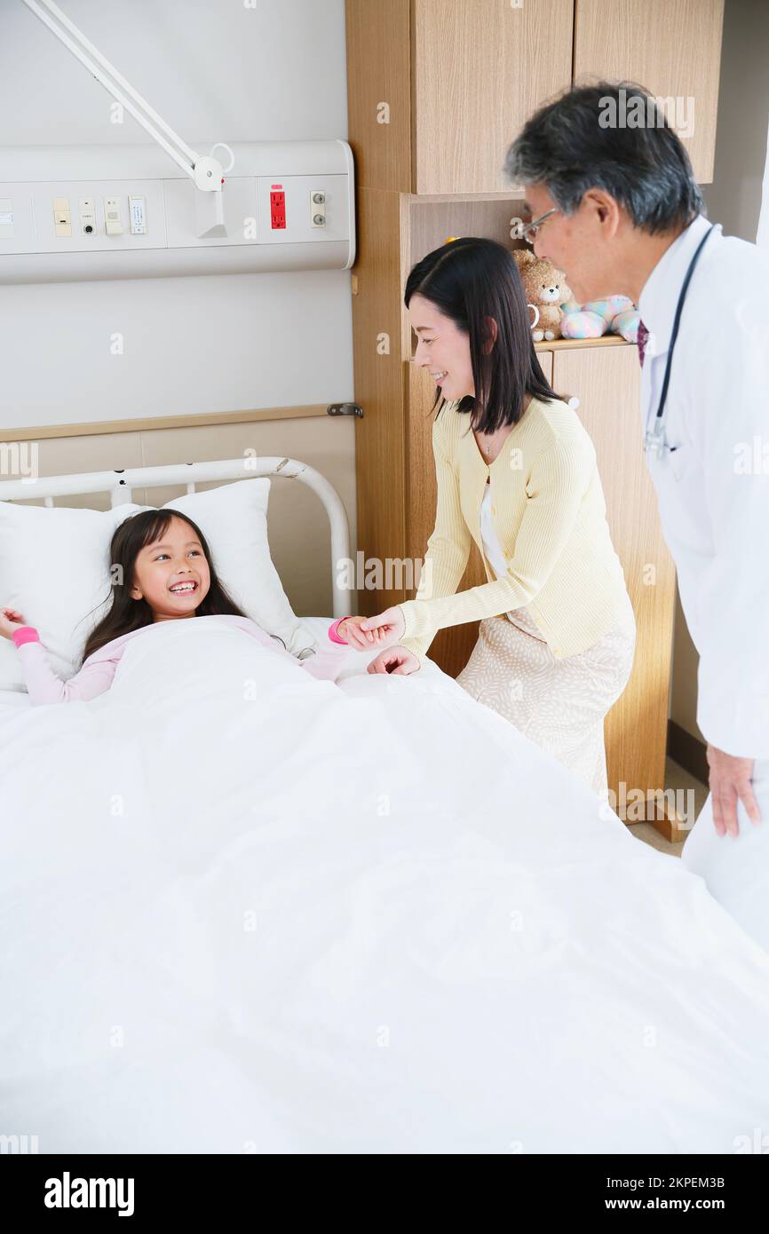 Japanese girl being examined by a doctor in a hospital room Stock Photo ...
