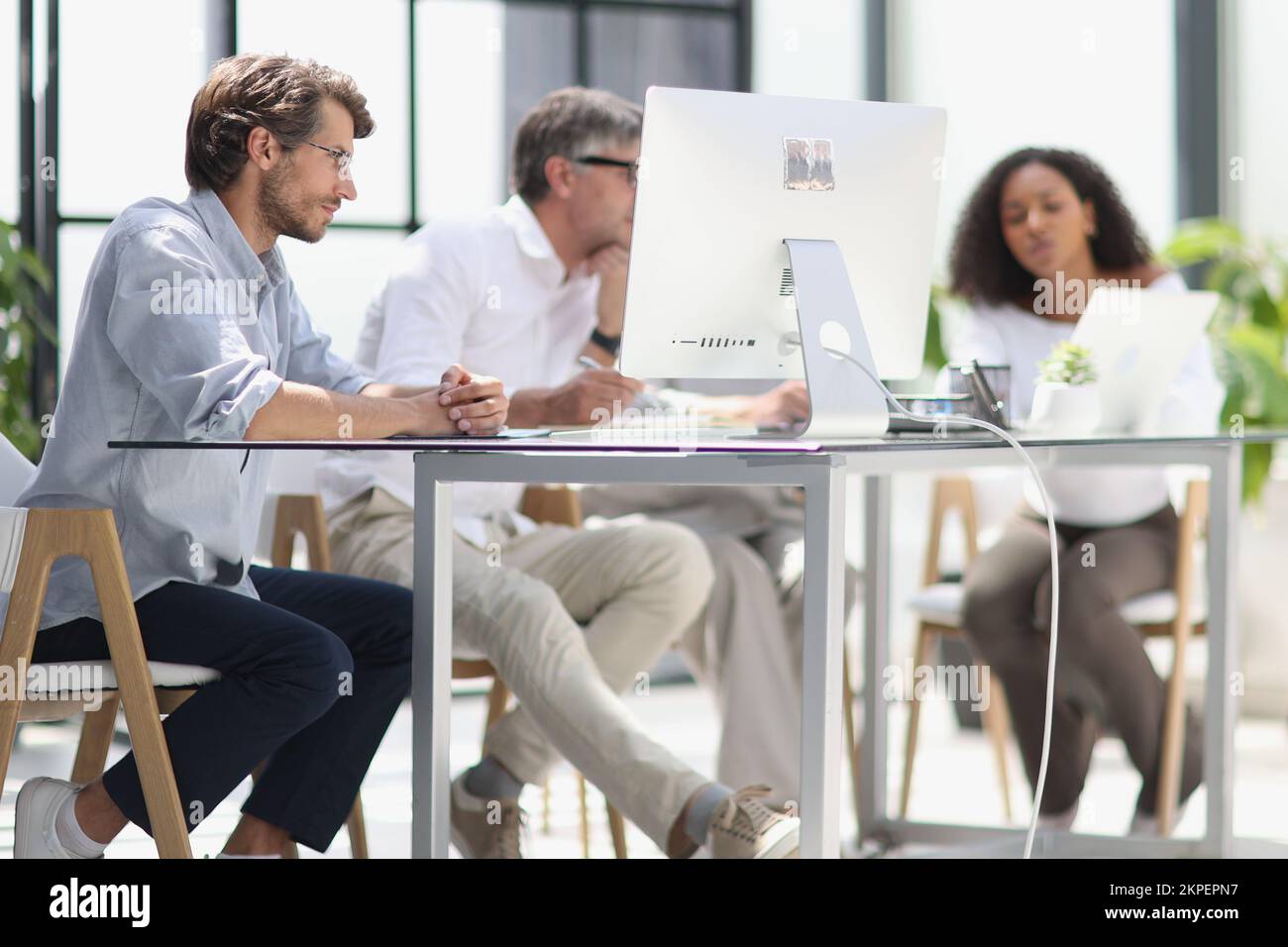 Conversation between managers and employees in the office Stock Photo ...