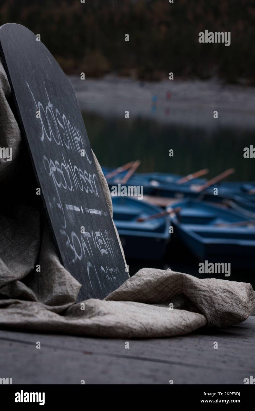 Closed sign in front of a boat rental. Cold autumn feeling through a ...