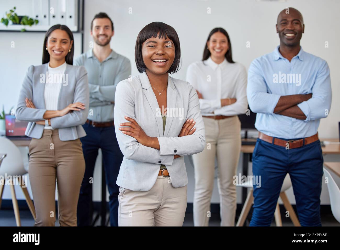 Black woman, leadership and portrait of business people with arms ...
