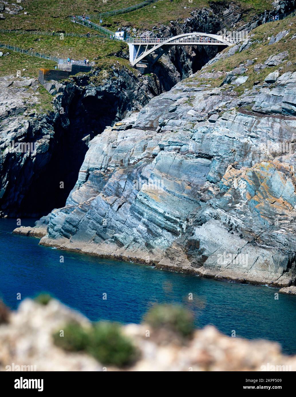 Reinforced concrete footbridge over dramatic sea gorge linking Cloghane ...