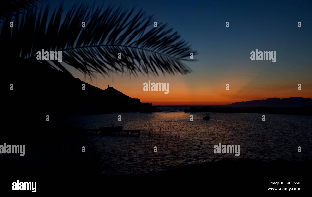 Southwestern tip of Turkey. Sunset from the ancient city of Datca Knidos. Yazikoy village harbor ...