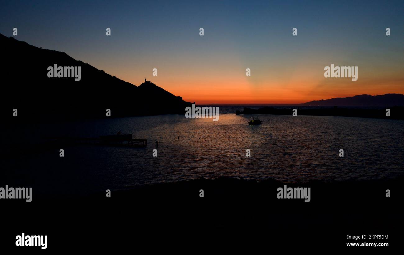 Southwestern tip of Turkey. Sunset from the ancient city of Datca Knidos. Yazikoy village harbor ...