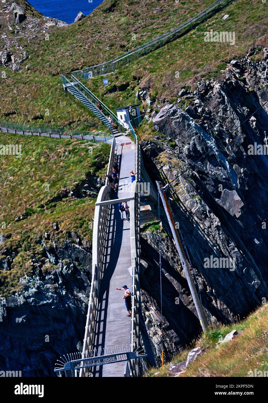 Reinforced concrete footbridge over dramatic sea gorge linking Cloghane ...