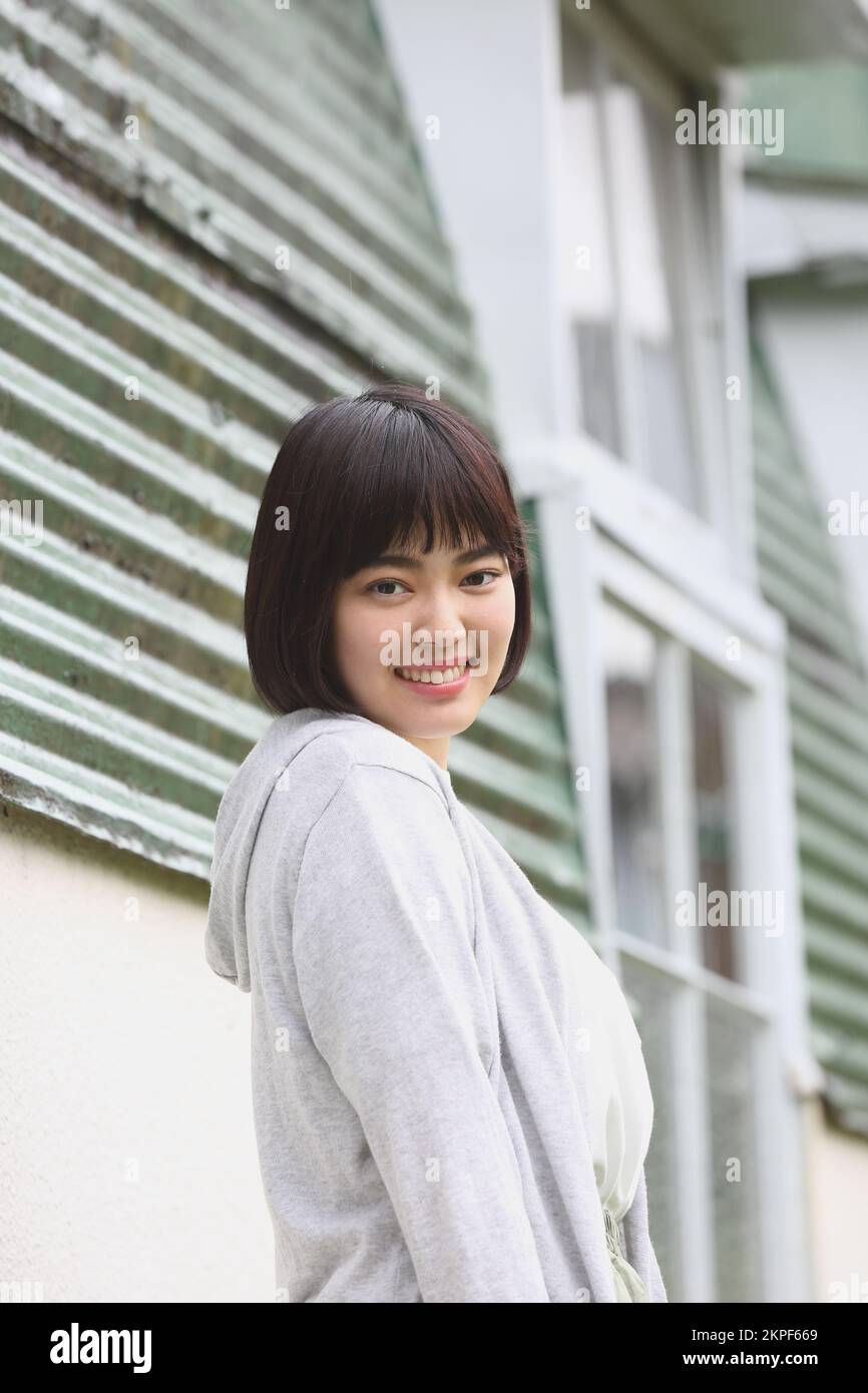 Young Japanese woman heading out Stock Photo - Alamy