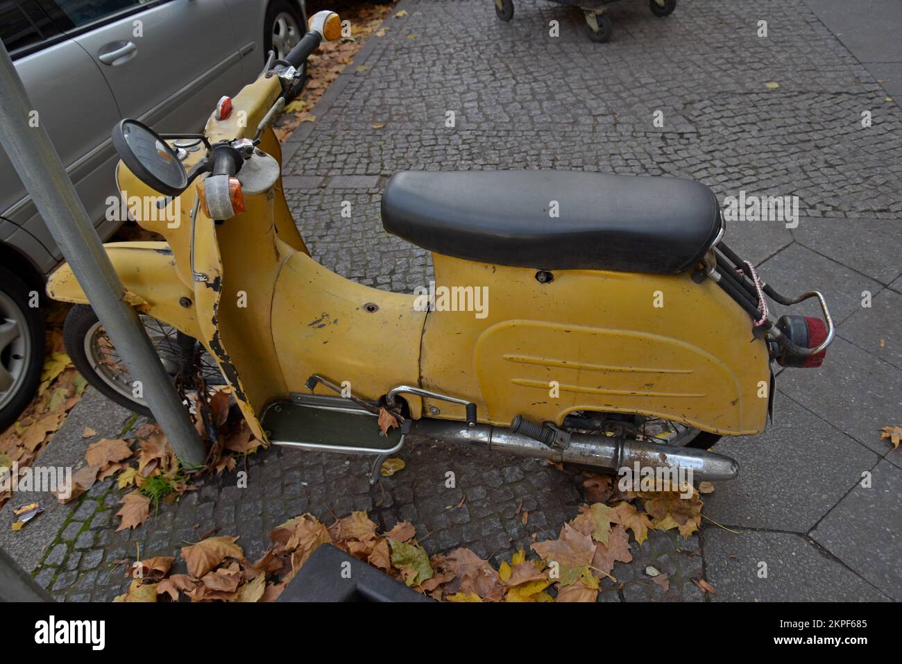 A classic Schwalbe step through moped on the street in Belin, Germany ...