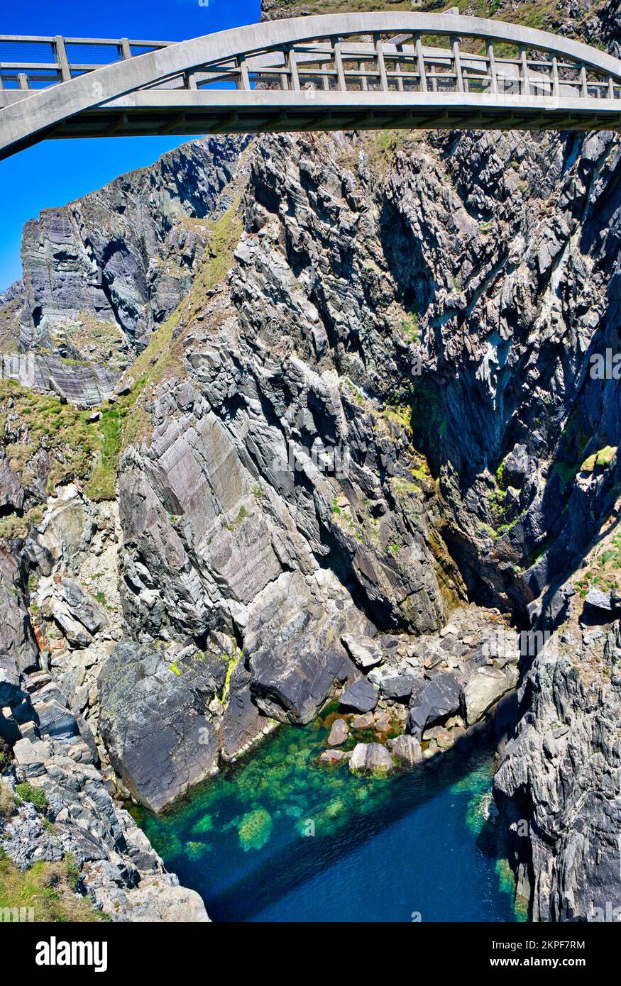 Reinforced concrete footbridge over dramatic sea gorge linking Cloghane ...
