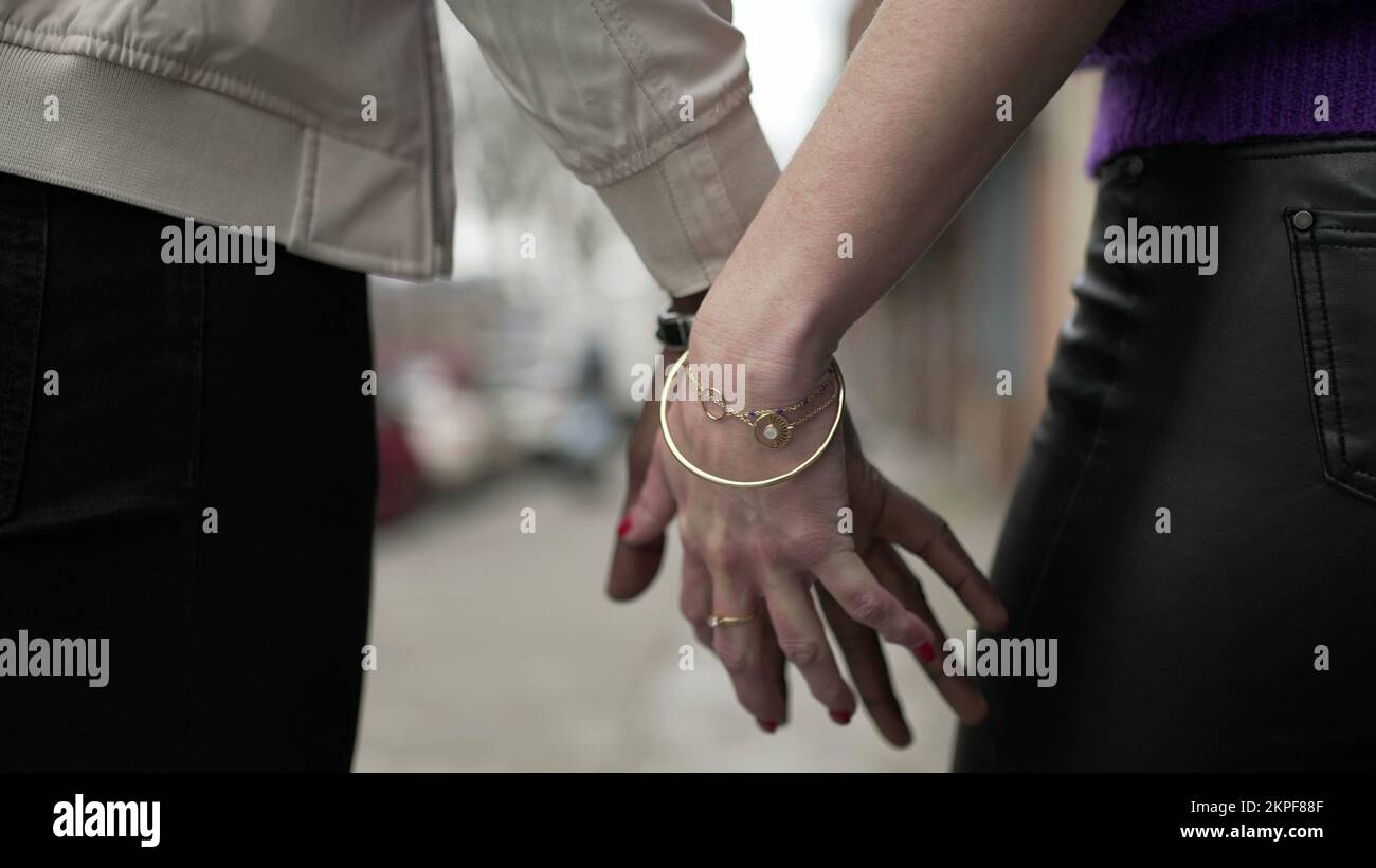 Couple disjoining hands, lovers separating Stock Photo - Alamy