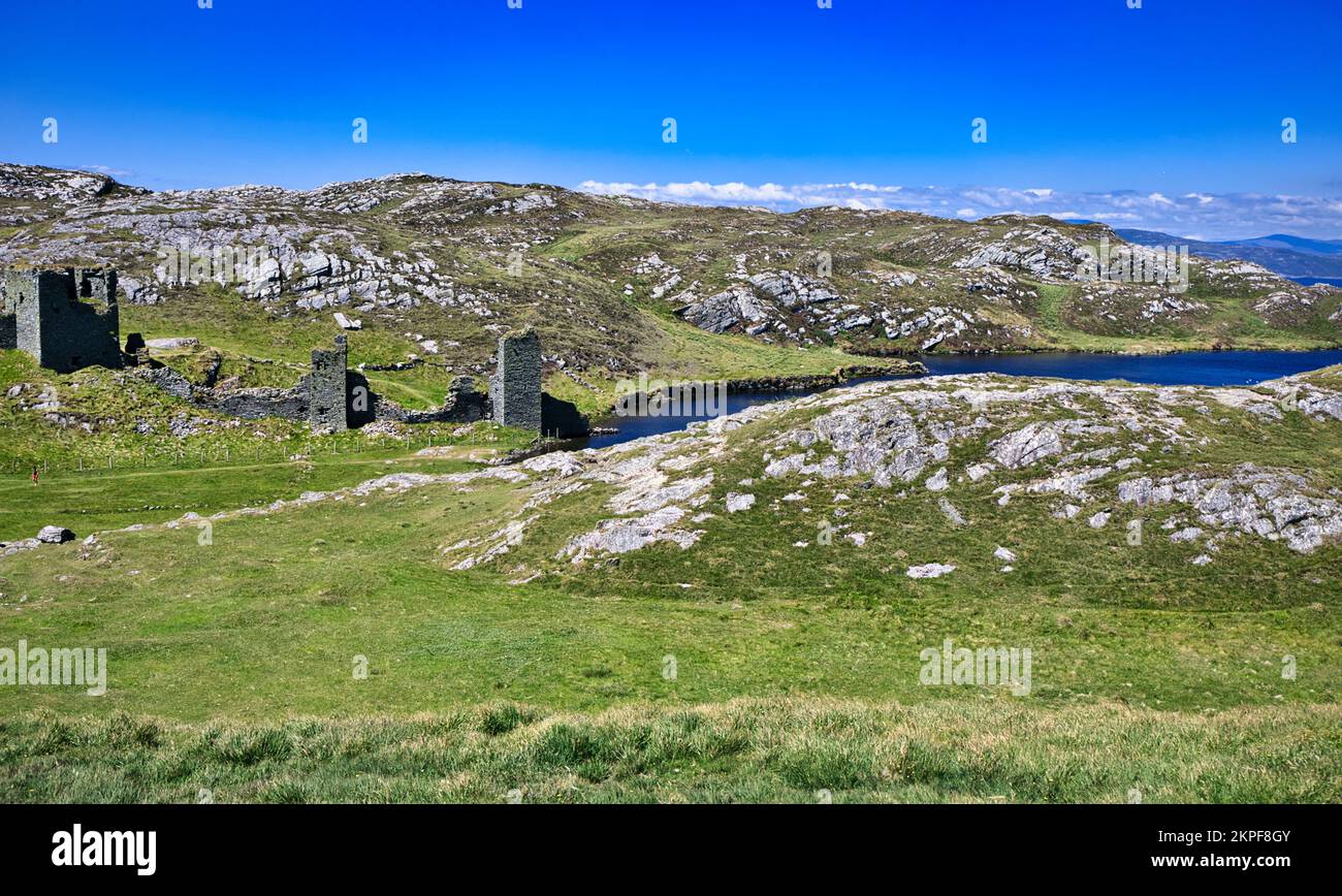 13th century Dunlough Castle set atop cliffs next to the Dun Lough Lake ...