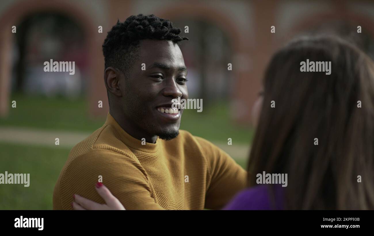 Friendly happy black African man on a date with girl Stock Photo - Alamy