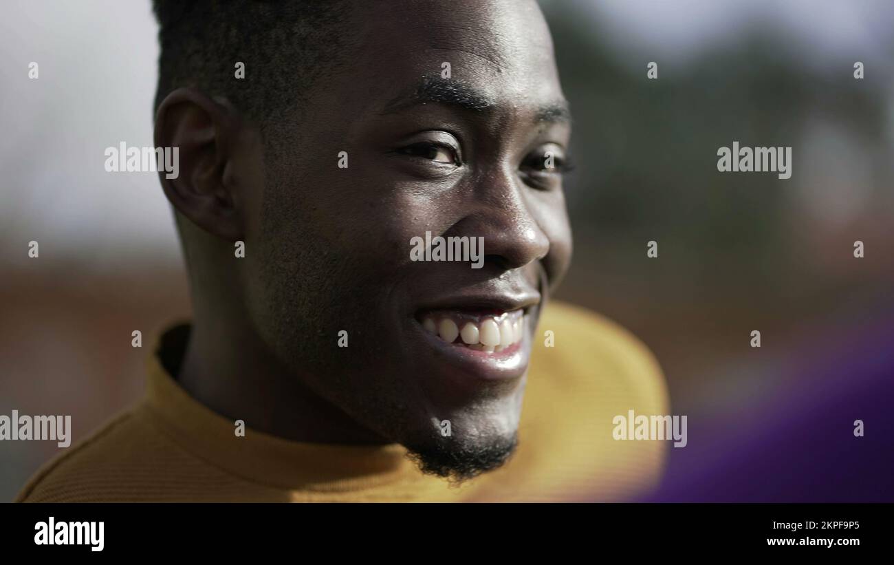 Happy black African man smiling and laughing portrait face close-up ...