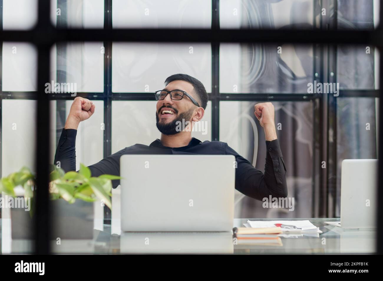 Business man sitting at his desk in the office Stock Photo - Alamy