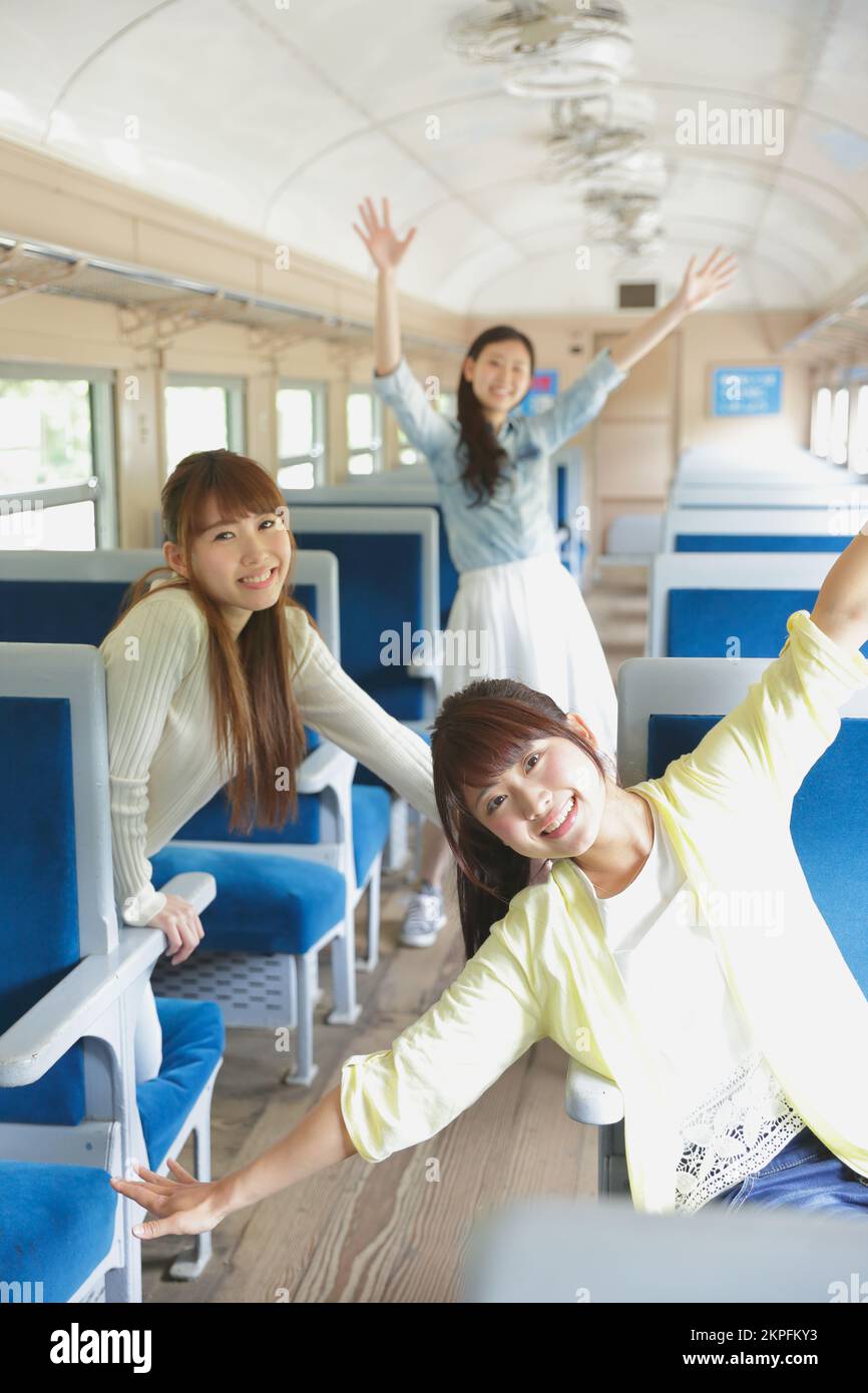 Japanese women having fun on the train Stock Photo - Alamy