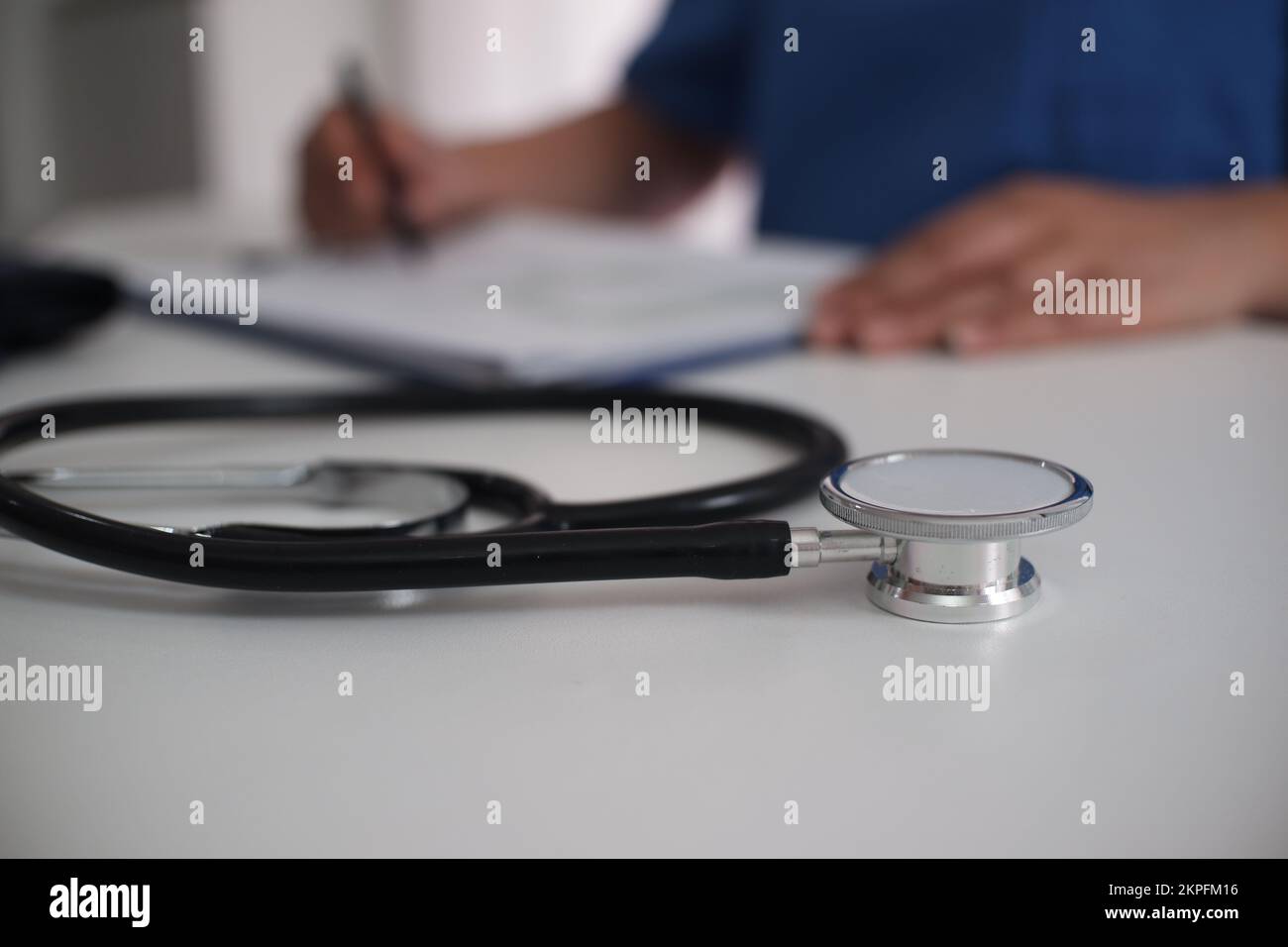 Doctor's working table. Focus on stethoscope. Female medicine doctor ...