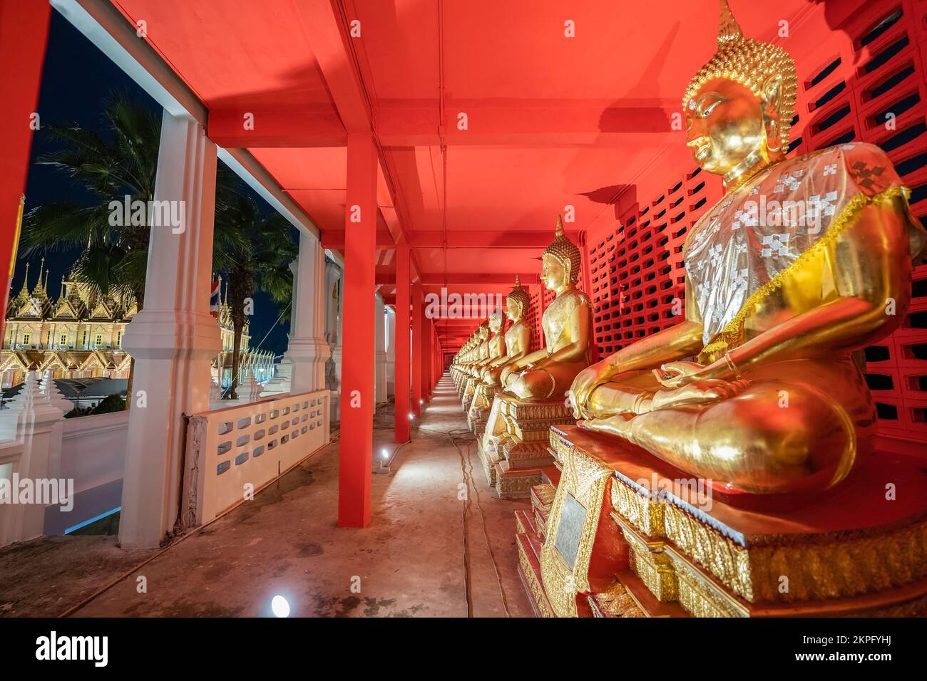 Several golden statues of Buddha statues in meditation posture are ...