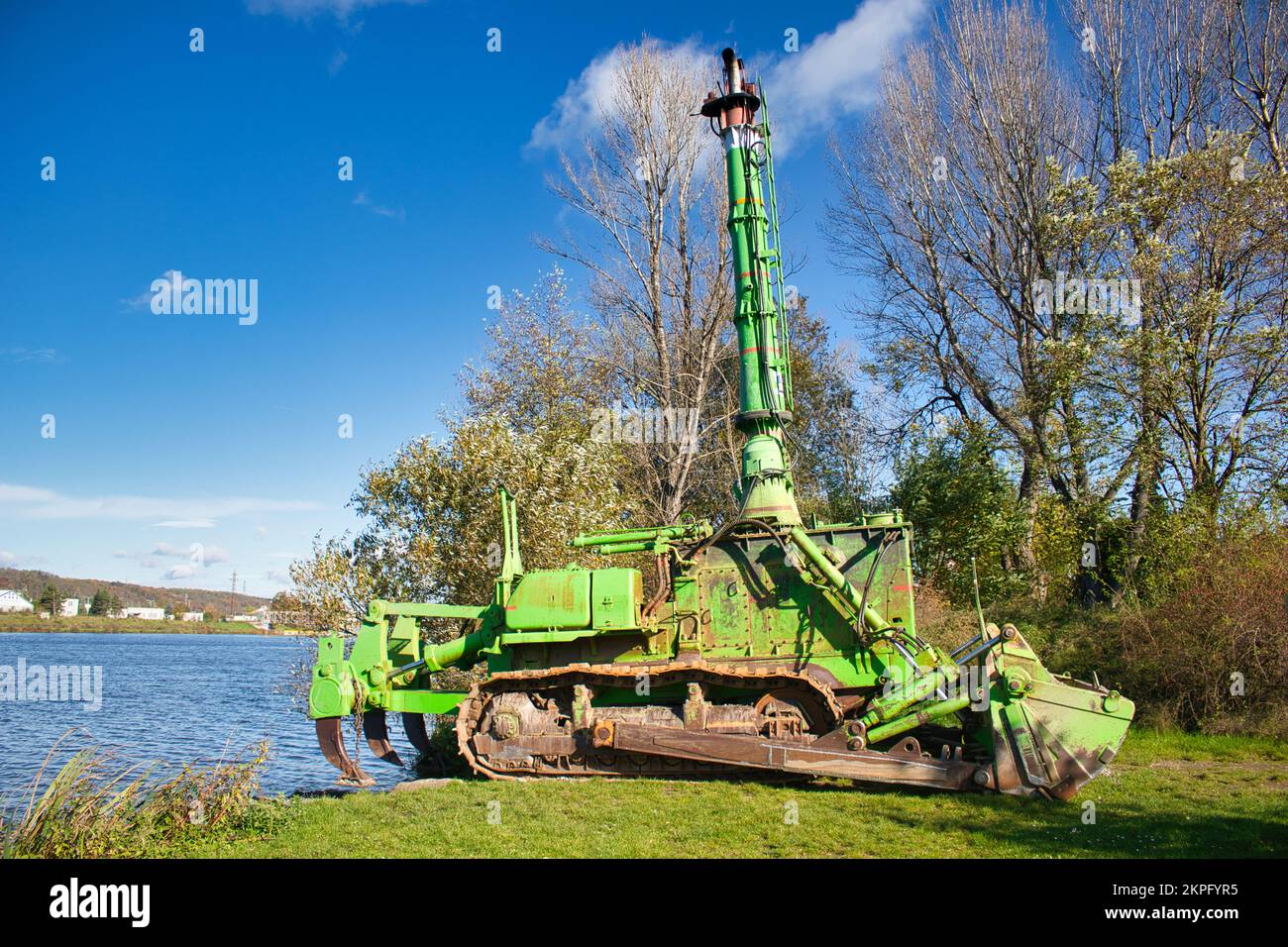Komatsu amphibious dozer on a river bank in autumn day Stock Photo - Alamy
