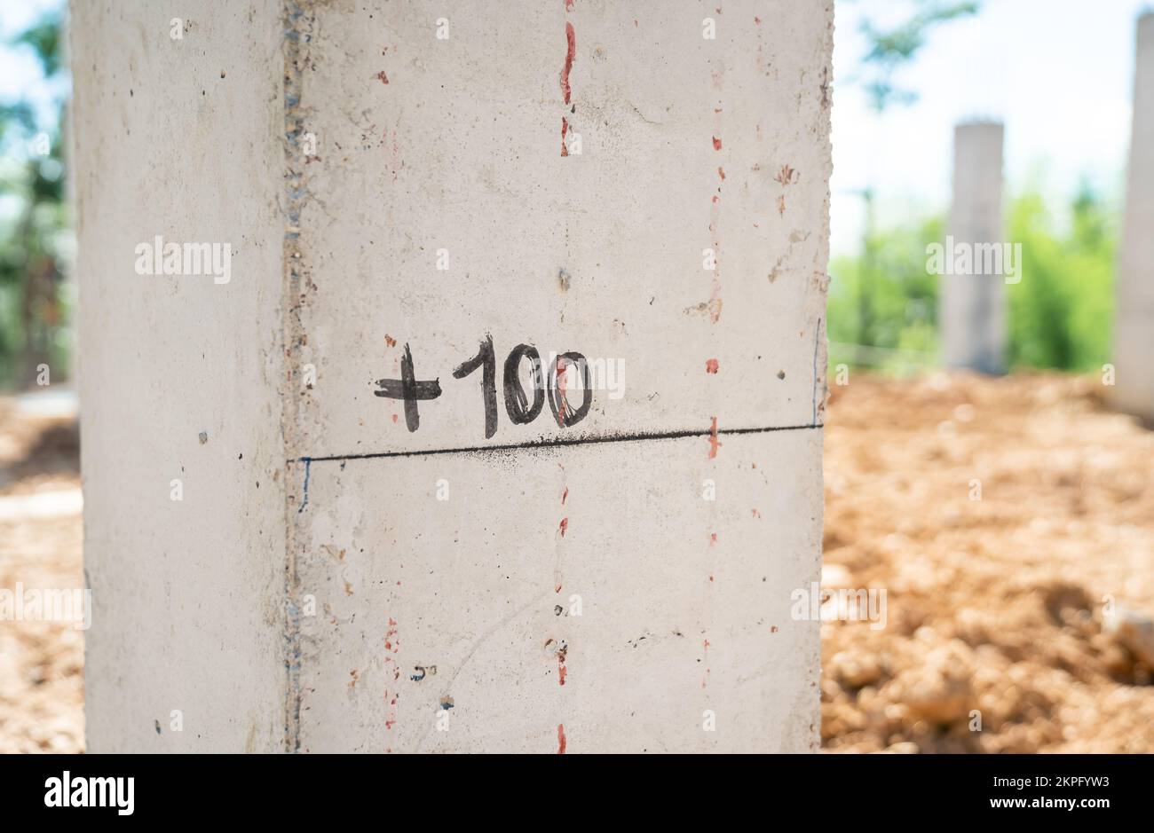 Close up of reinforced concrete column structure with written ...
