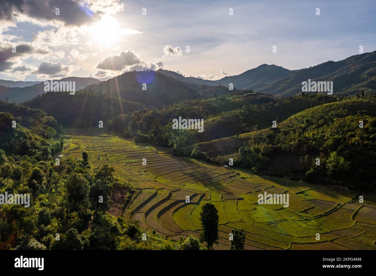 Aerial view of terraced agriculture field among greenery mountains with ...
