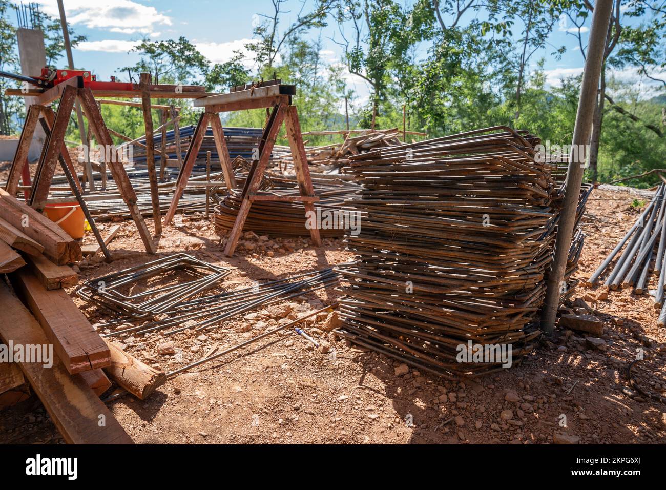 Big pile of reinforced steel bar, rebar, and stacked wood was left ...