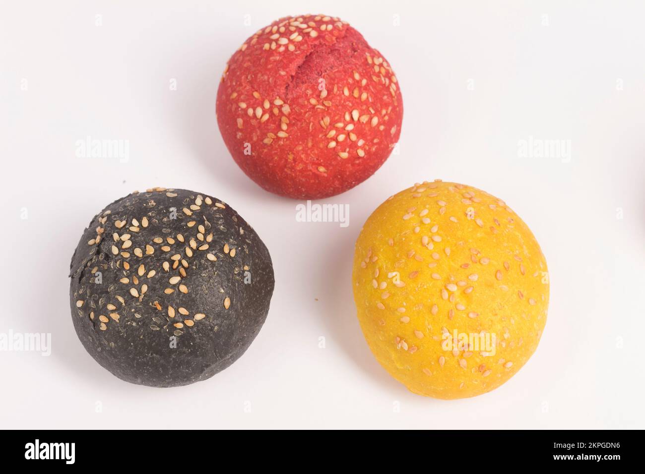 Colorful seasoned bread resting on a white background Stock Photo - Alamy