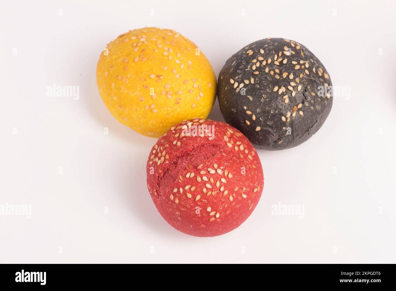 Colorful seasoned bread resting on a white background Stock Photo - Alamy