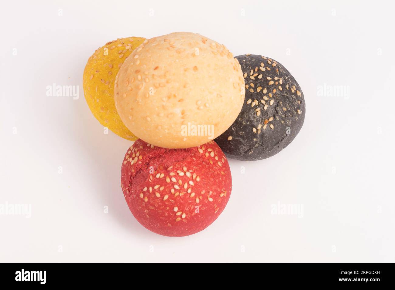 Colorful seasoned bread resting on a white background Stock Photo - Alamy
