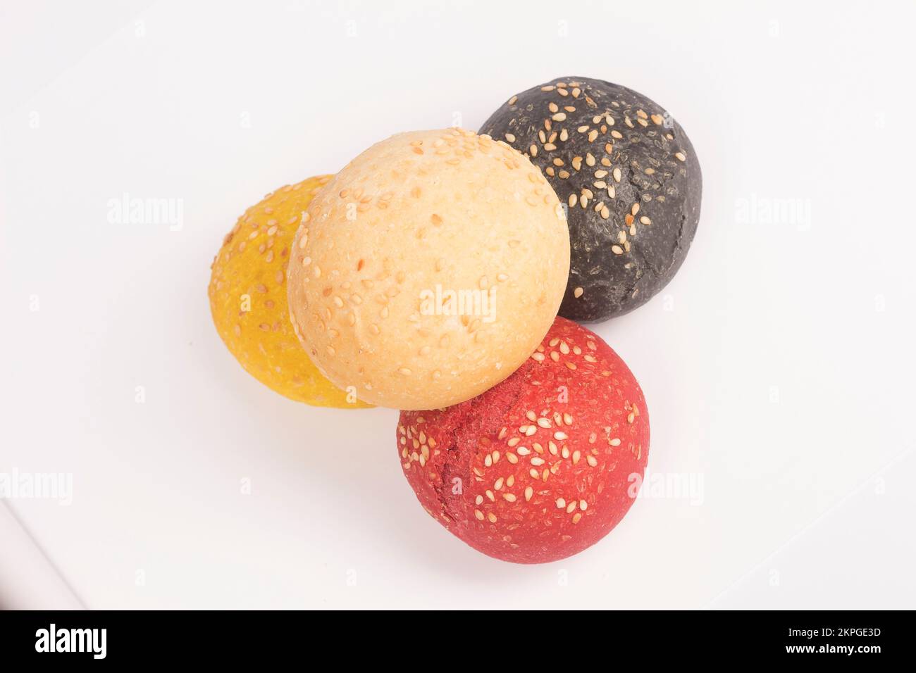 Colorful seasoned bread resting on a white background Stock Photo - Alamy