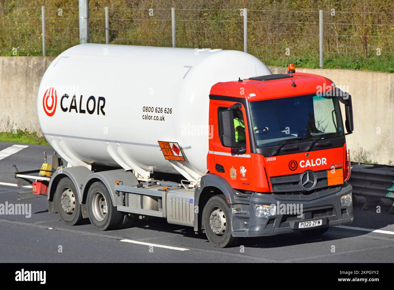 Red Lorry Truck With Driver In Cab Of Mercedes Chassis Cab White Calor Delivery Gas Tanker