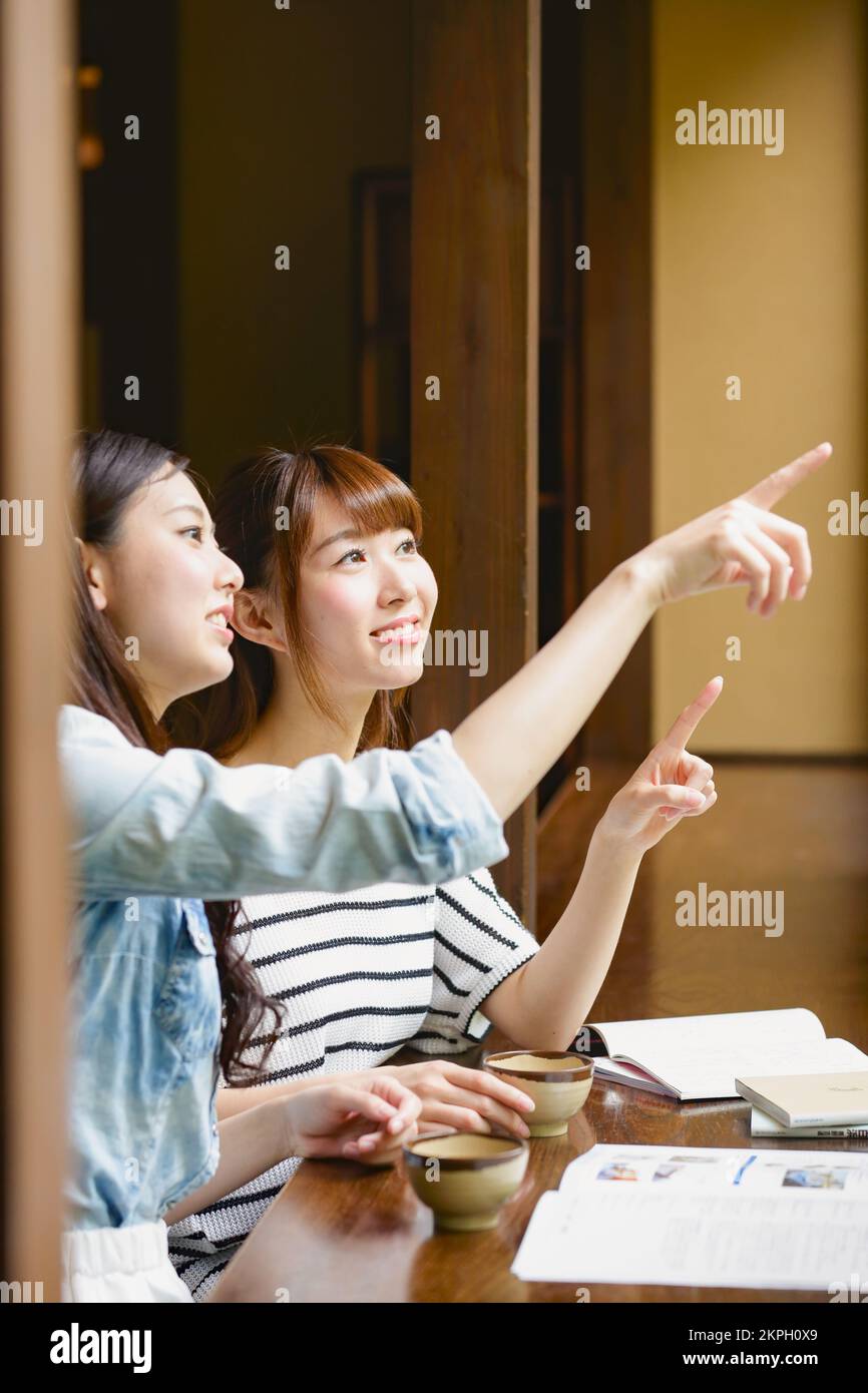 Japanese women having a conversation Stock Photo - Alamy