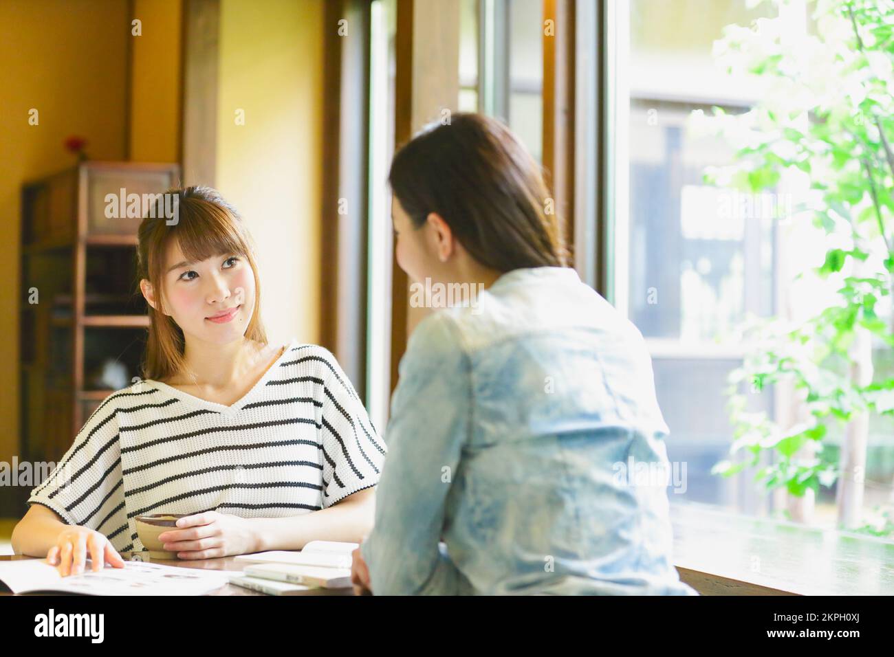 Japanese women having a conversation Stock Photo - Alamy