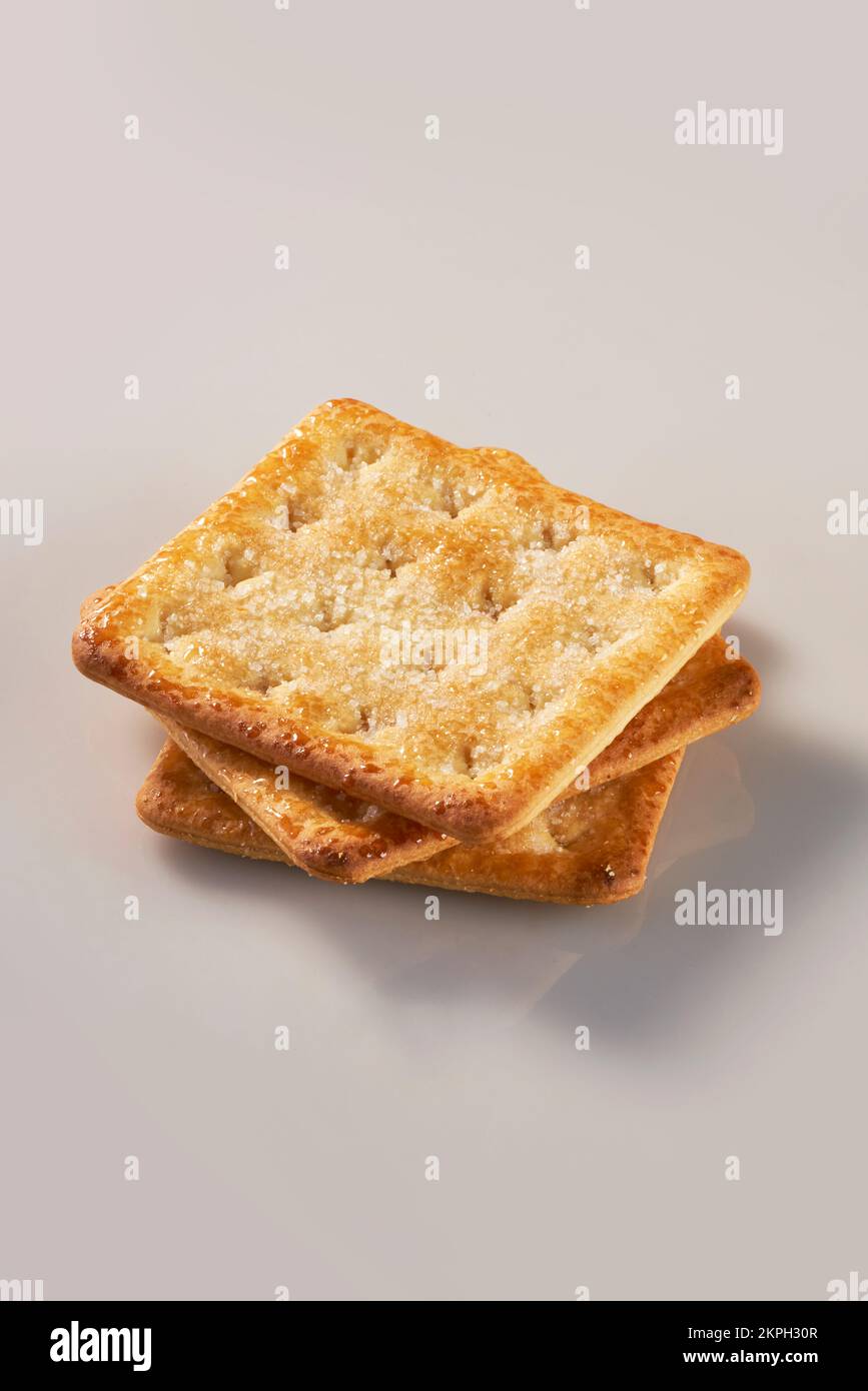 A pile of three sweet crackers sprinkled with sugar Stock Photo - Alamy