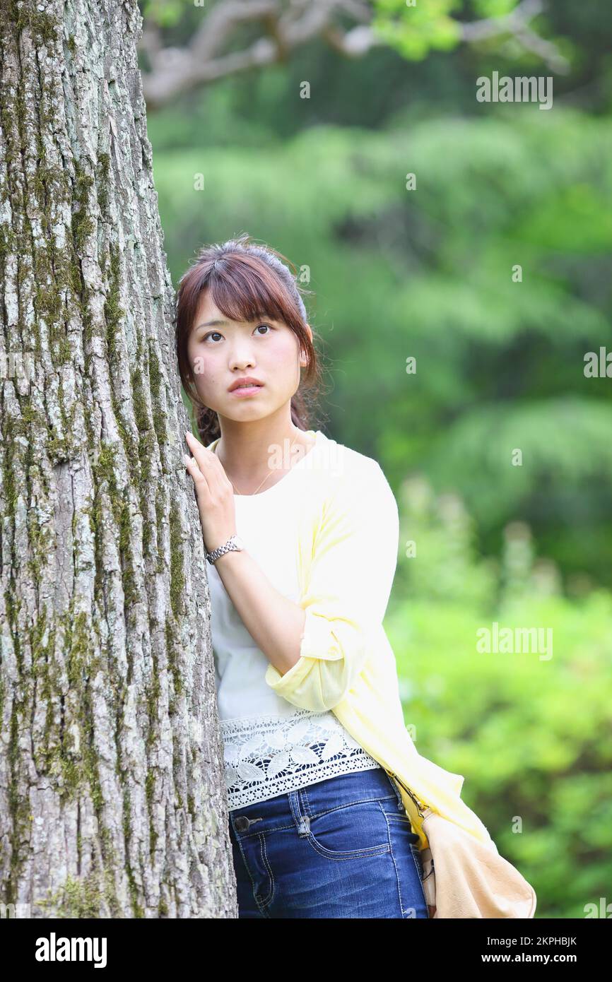 Leaning solo asian woman hi-res stock photography and images - Alamy