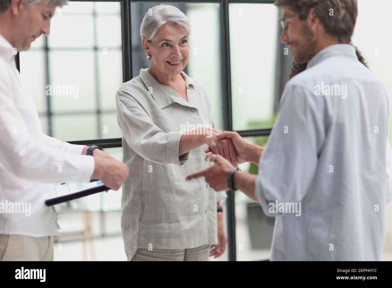 Conversation between managers and employees in the office Stock Photo ...