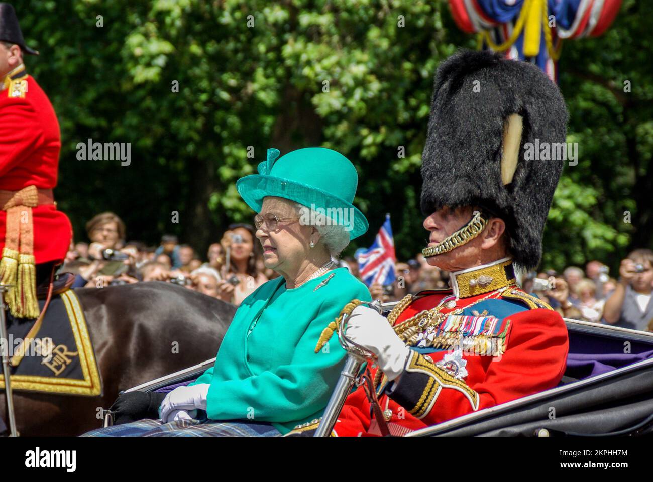 Queen Elizabeth II and Prince Philip in open carriage in The Mall ...