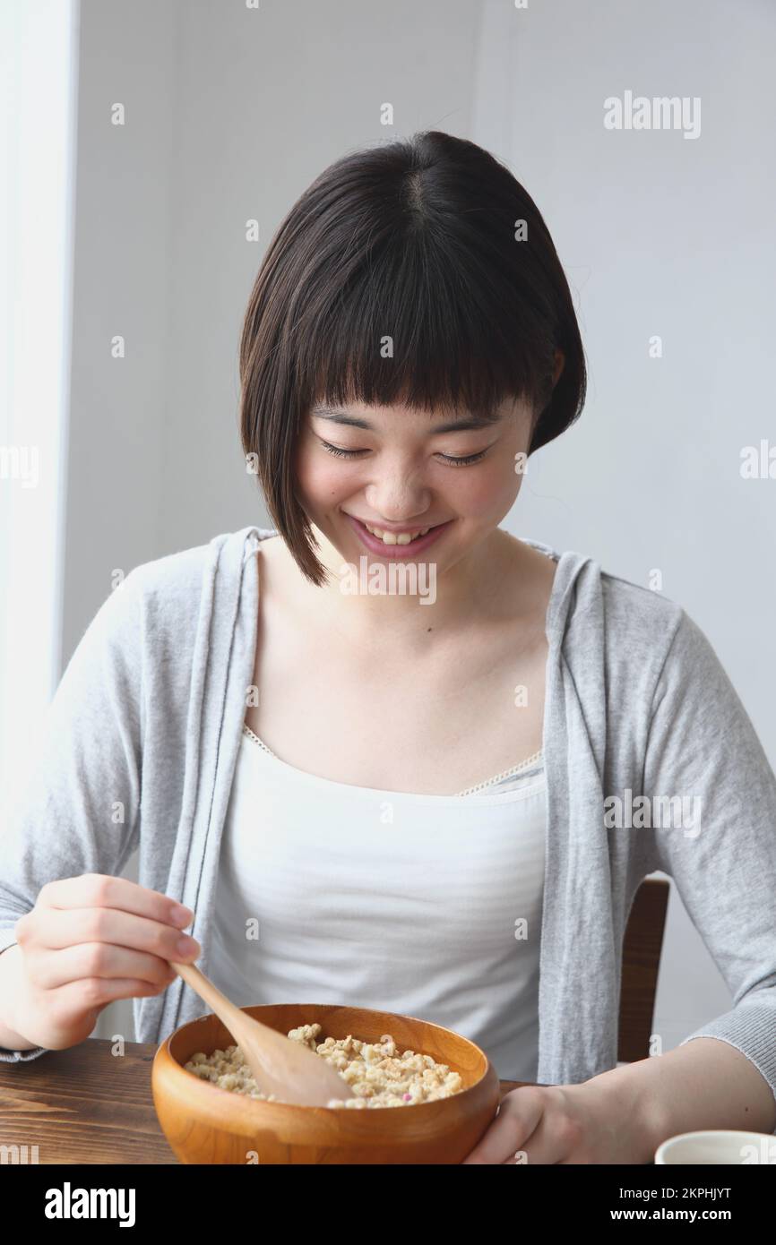 Young Japanese woman having breakfast Stock Photo - Alamy