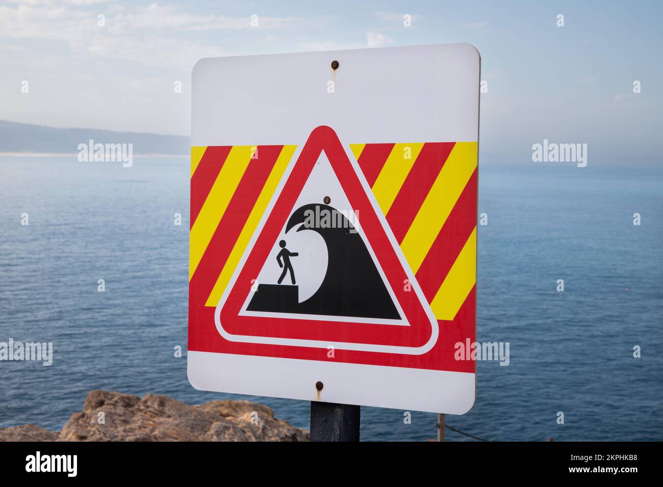 warning sign against high waves Stock Photo - Alamy