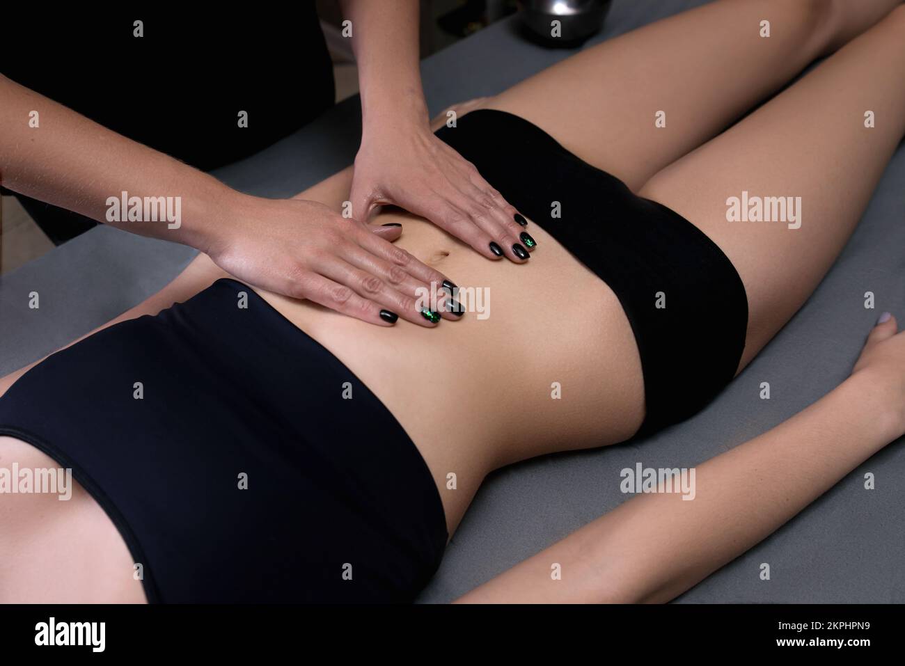 Young Woman Getting Spa Belly Massage Treatment At A Medical Clinic