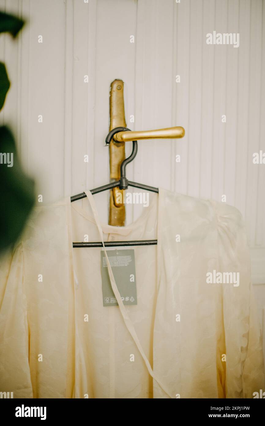 Beautiful delicate dress with a price tag on a hanger, stylist Stock ...