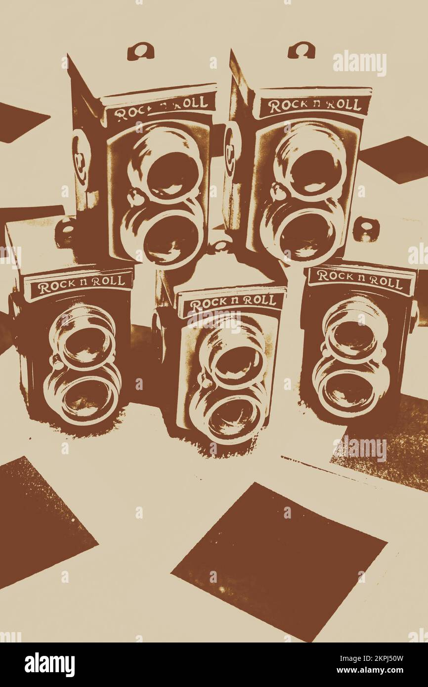 Vintage creative artwork on old twin lens camera icons over blank ...