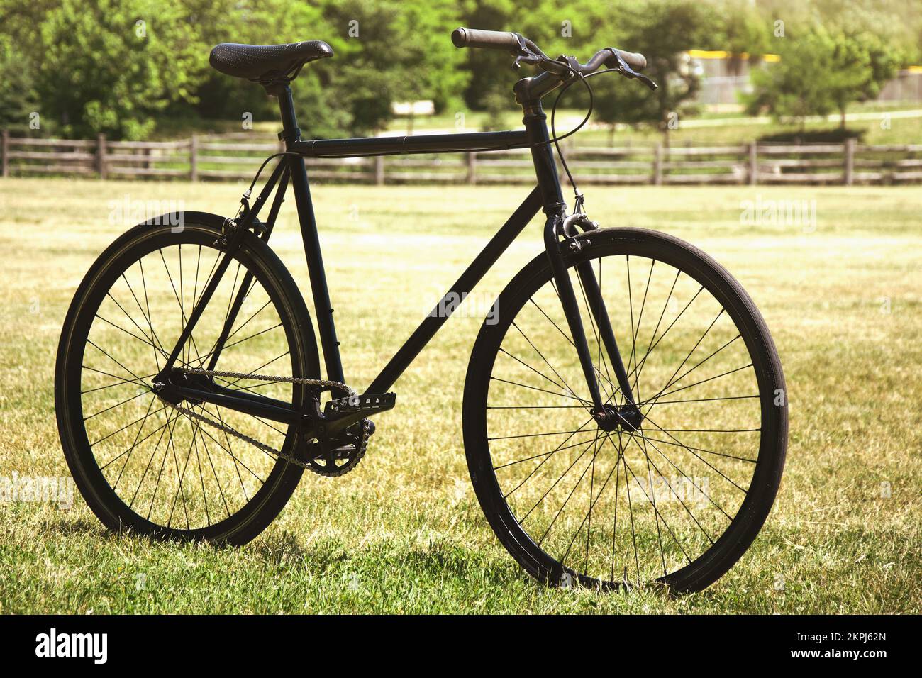 Fixie black bike with grass background Stock Photo - Alamy