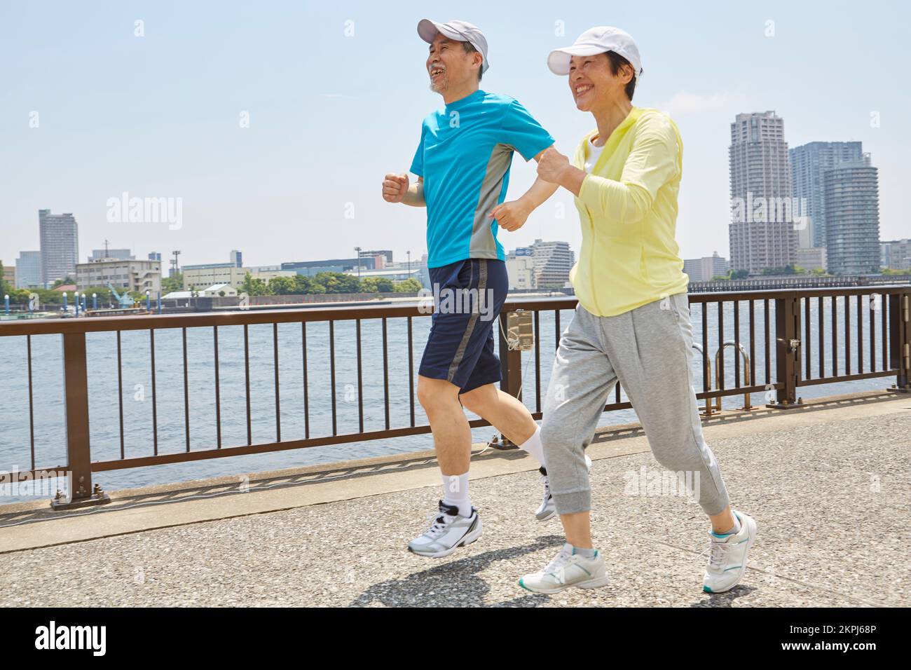Japanese senior couple jogging Stock Photo - Alamy